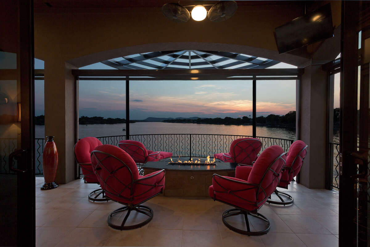 See a boat dock under a house and other luxury amenities