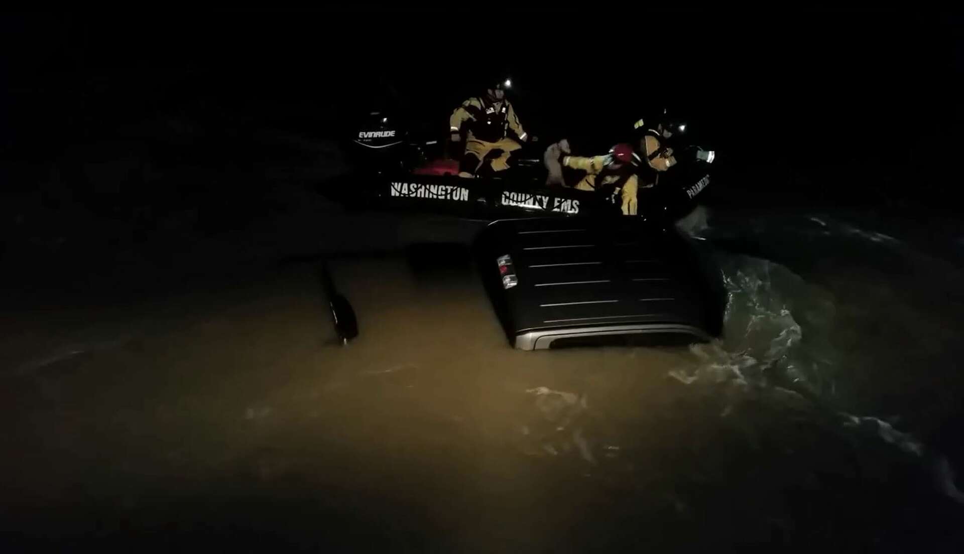 Raw video shows Texas rescue workers pulling dog, man from submerged ...