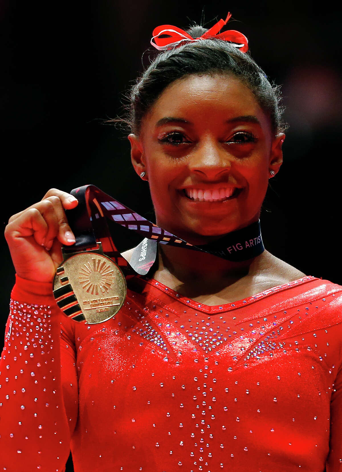 Spring's Simone Biles wins third straight world all-around gymnastics title