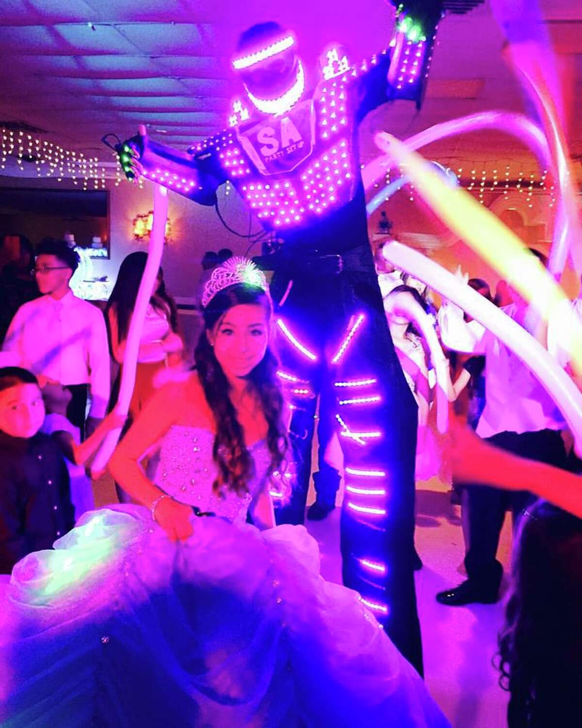 The 9-foot dancing robots party goers in San Antonio are going 'crazy' for