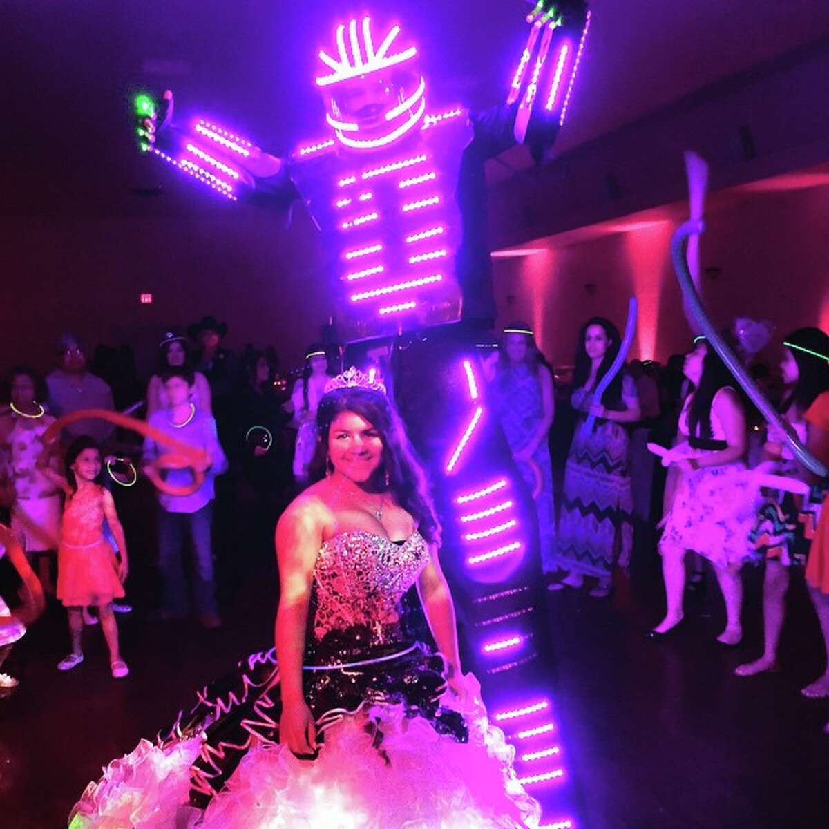 The 9-foot dancing, laser-shooting robots that partiers in San Antonio ...