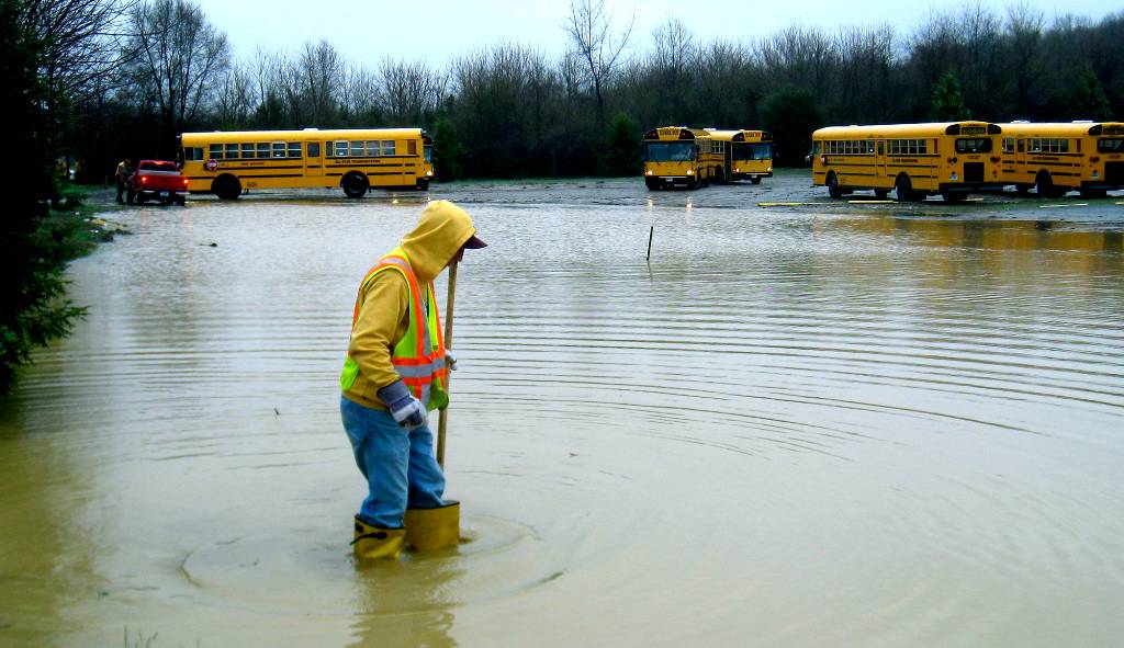 Mud slide fills New Milford school bus lot