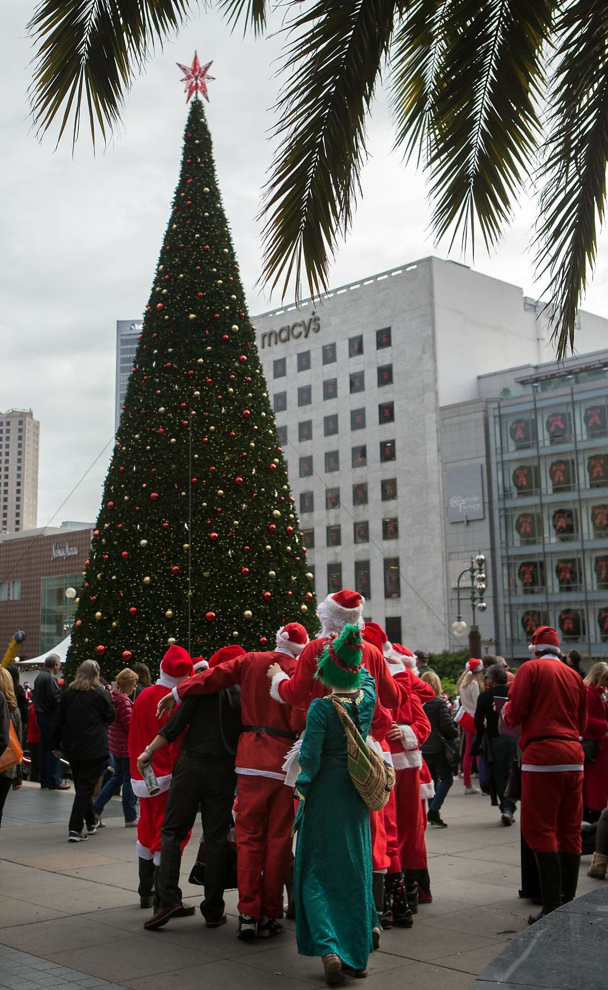 Santas and friends fill downtown for annual holiday bar hop