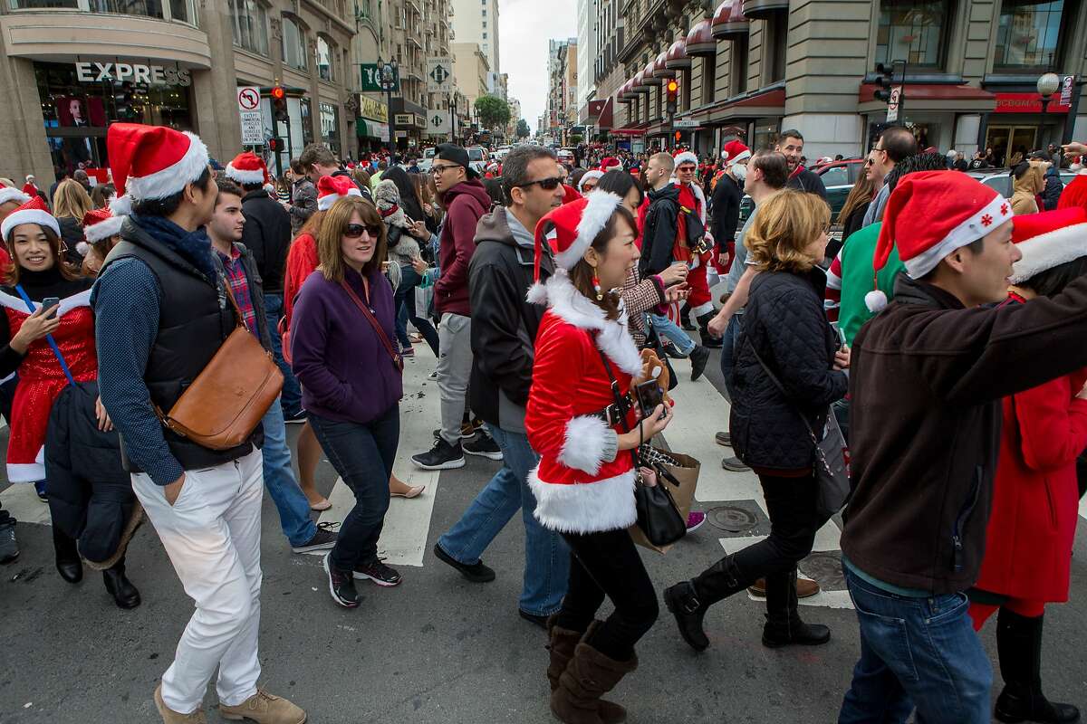 Santas and friends fill downtown for annual holiday bar hop
