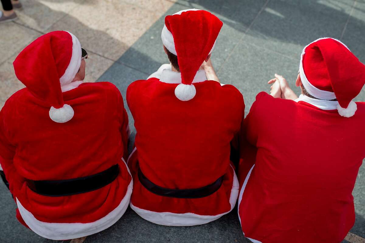 Santas and friends fill downtown for annual holiday bar hop