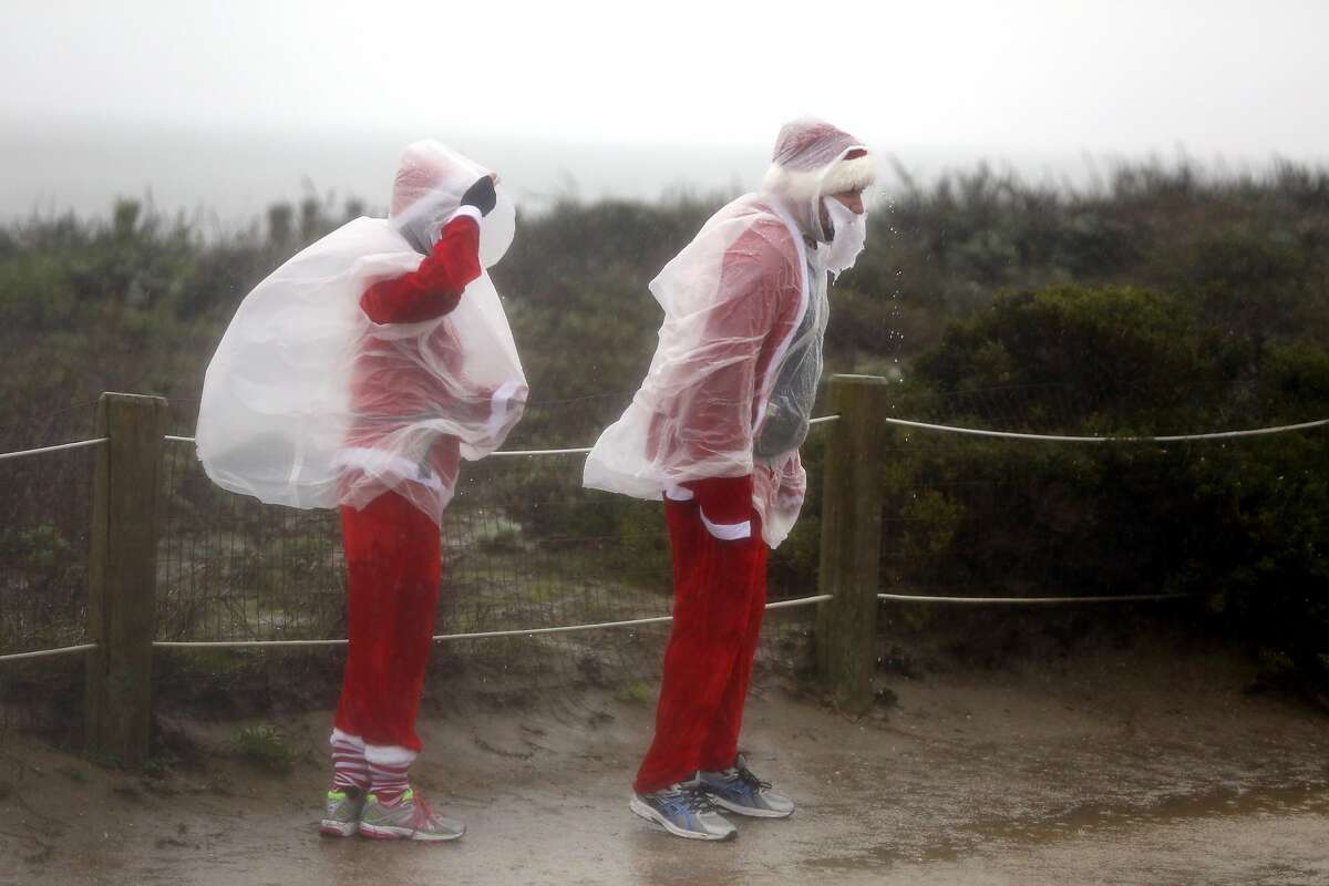 Soggy Santas slosh through rain, wind, hail in S.F. race