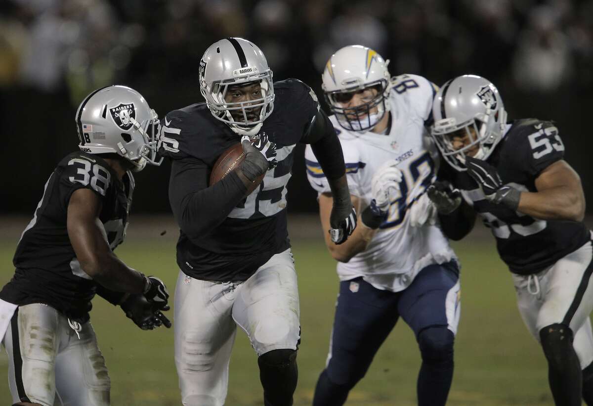 Raiders win in OT as Charles Woodson says goodbye