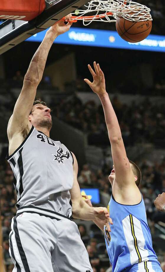 Boban Marjanovic's hands look impossibly huge - San Antonio Express-News