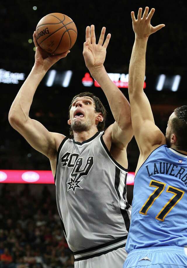 Boban Marjanovic's hands look impossibly huge - San Antonio Express-News