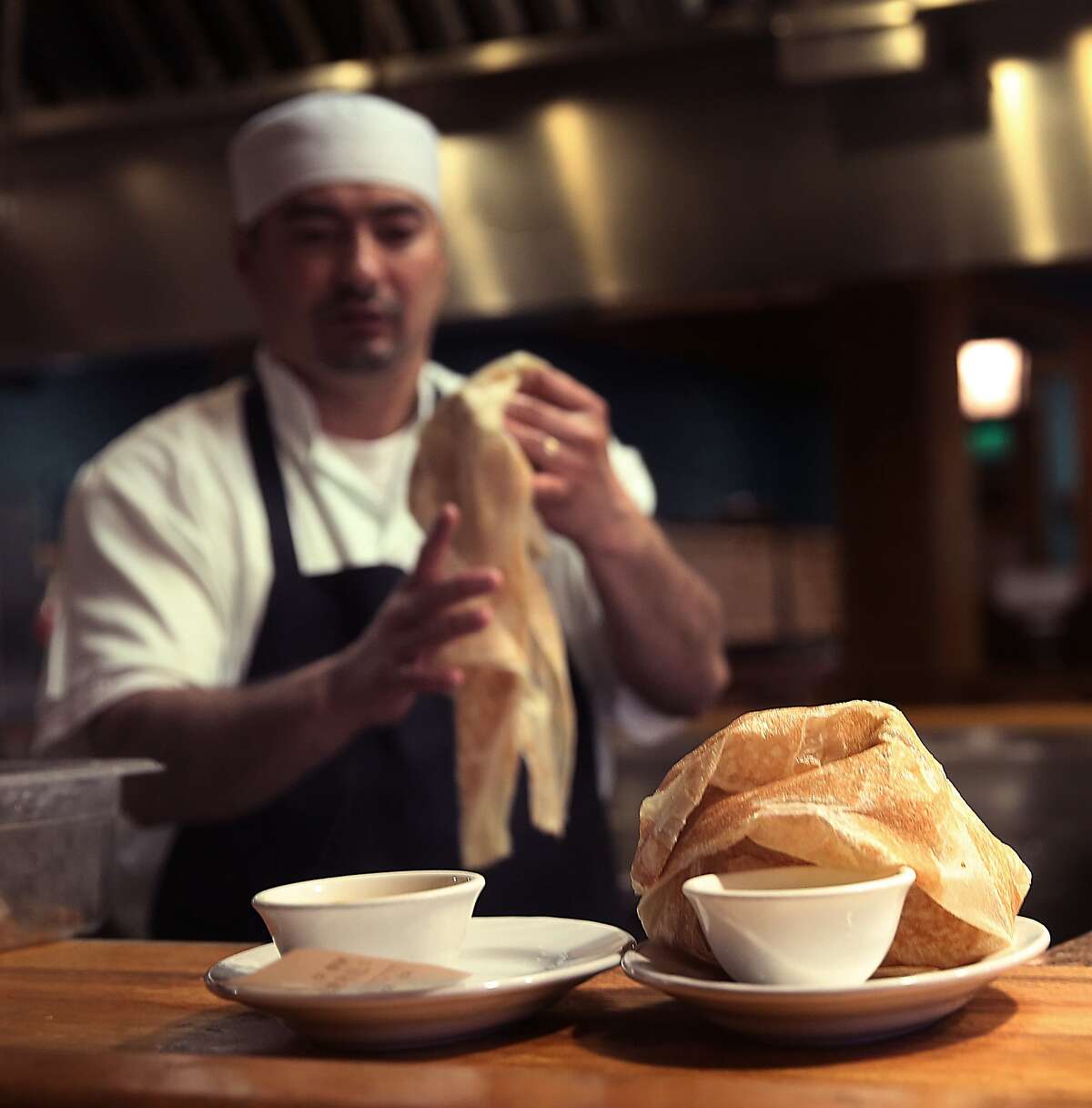 Making roti canai, a flaky Malaysian flatbread, is a spectacle