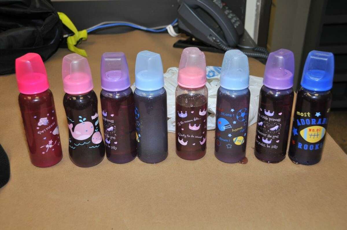 3 arrested after cops find sub-machine gun, baby bottles filled with ...
