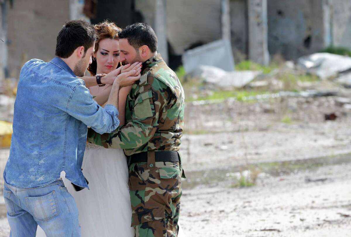 Couple takes eye-opening wedding photos in bombed-out Syrian city