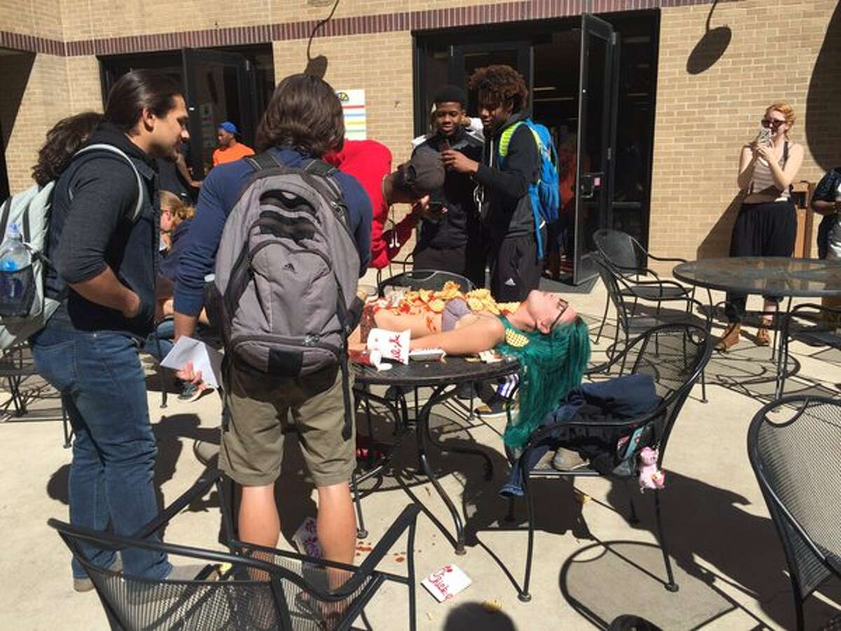 Texas State student who sat naked last semester covers herself in Chick ...