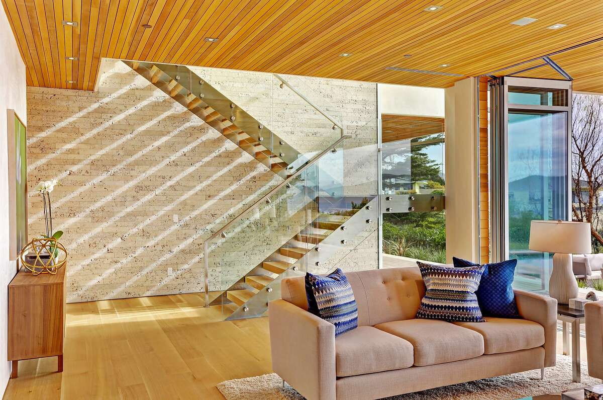 Retractable glass walls create exemplary indoor/outdoor living in Tiburon