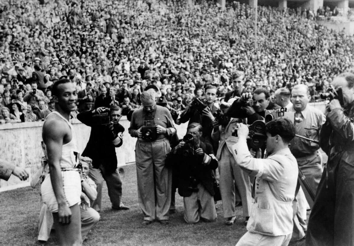 Historic photos show Jesse Owens smashing world records at Hitler's ...