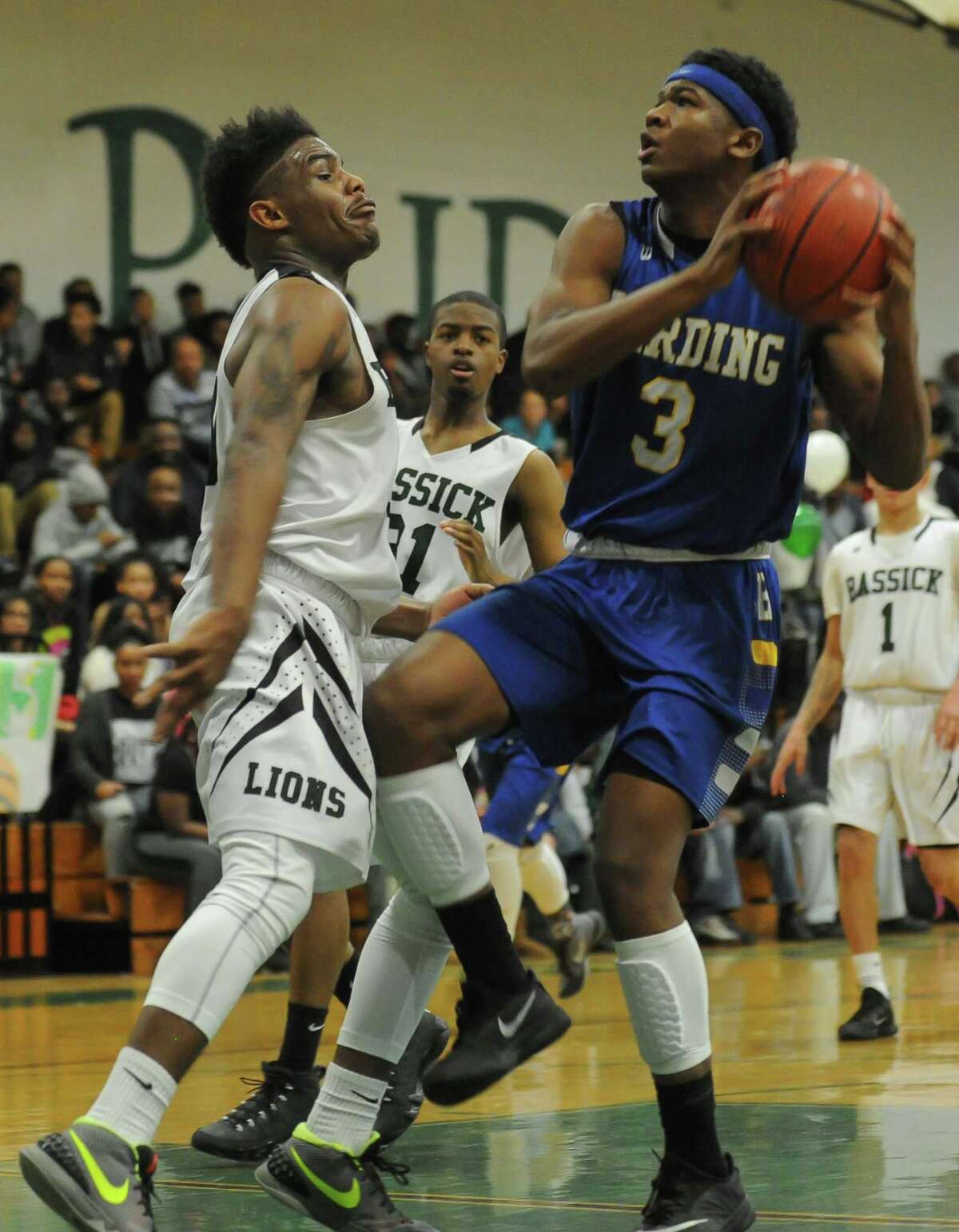 Bassick outlasts Harding in scoring marathon