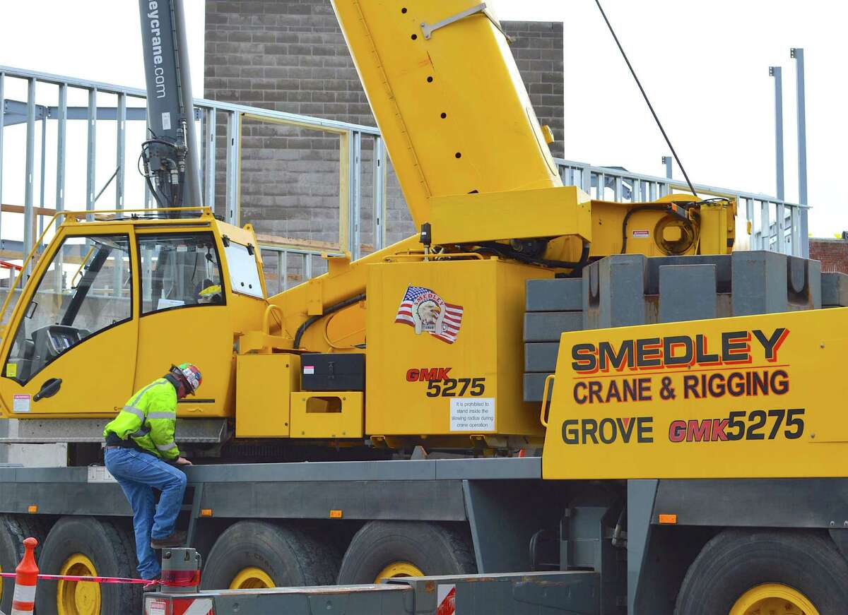Crane comes down at Bedford Square as project rises
