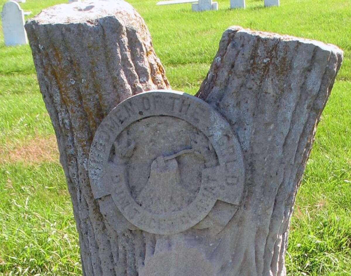 Why are old gravestones shaped like tree trunks?