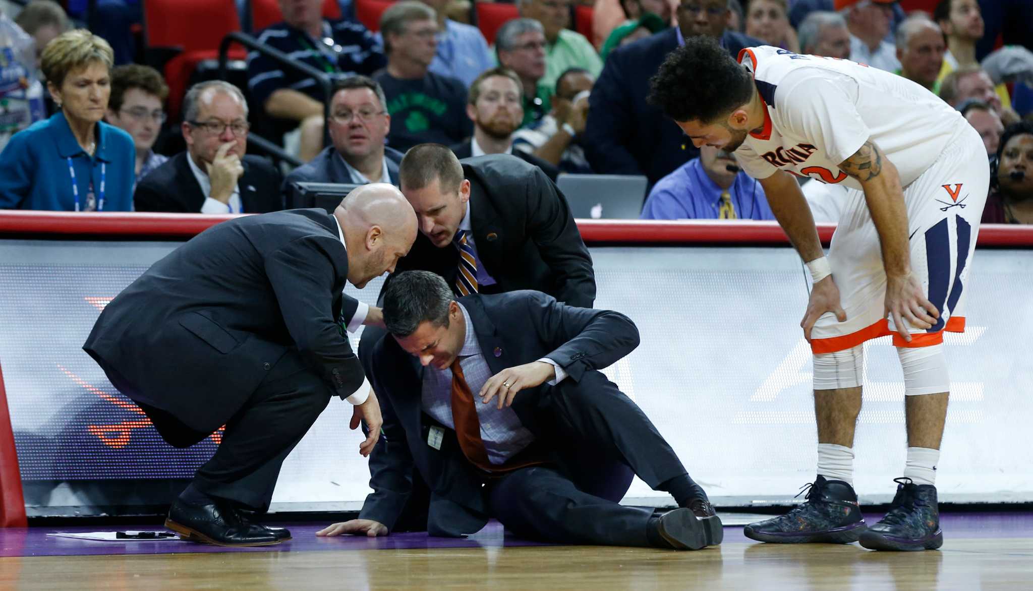 Virginia coach Tony Bennett collapses on the bench