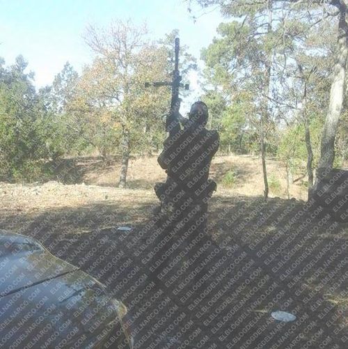 Masked assassins for the Juárez Cartel in Mexico shown holding guns in ...