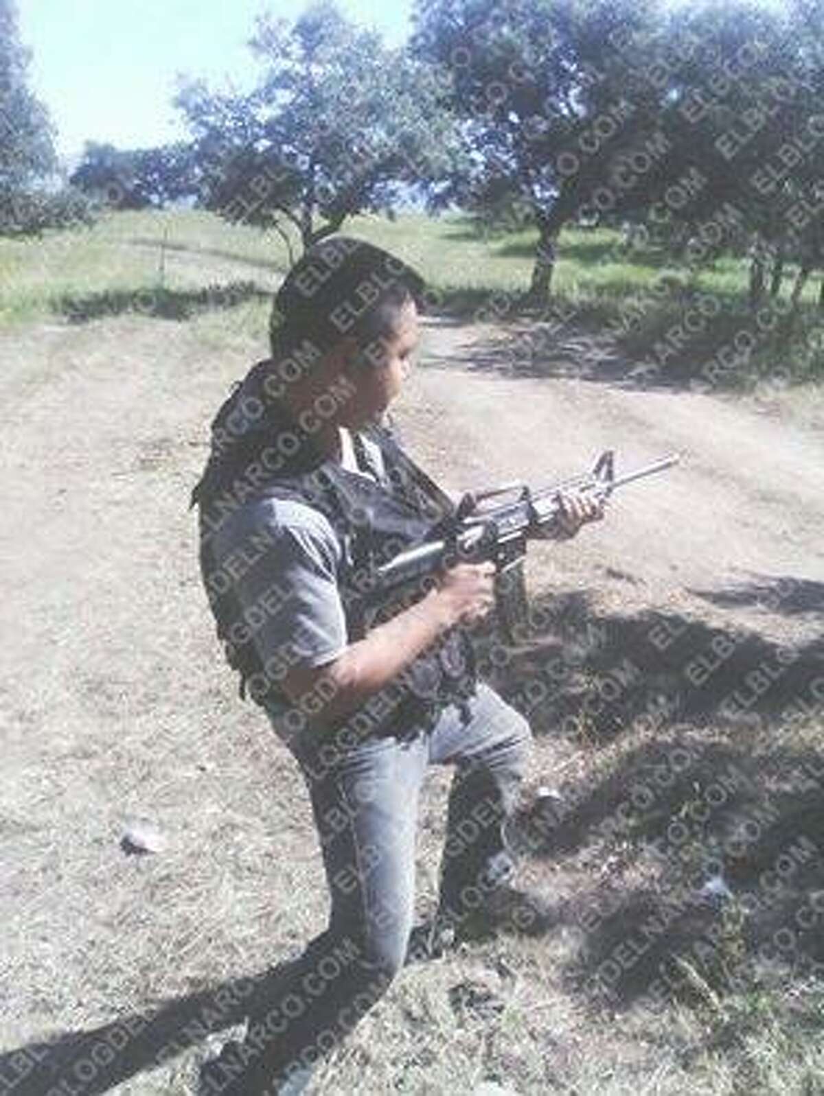 Masked assassins for the Juárez Cartel in Mexico shown holding guns in ...