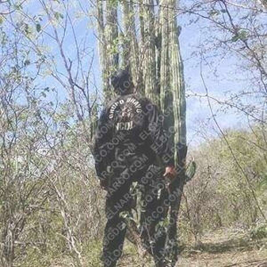 Masked assassins for the Juárez Cartel in Mexico shown holding guns in ...