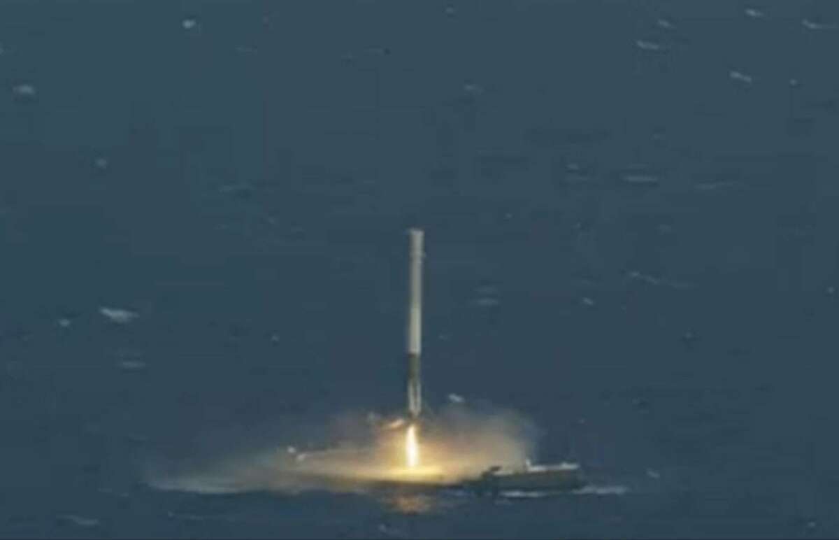 In a first, SpaceX lands booster rocket on barge