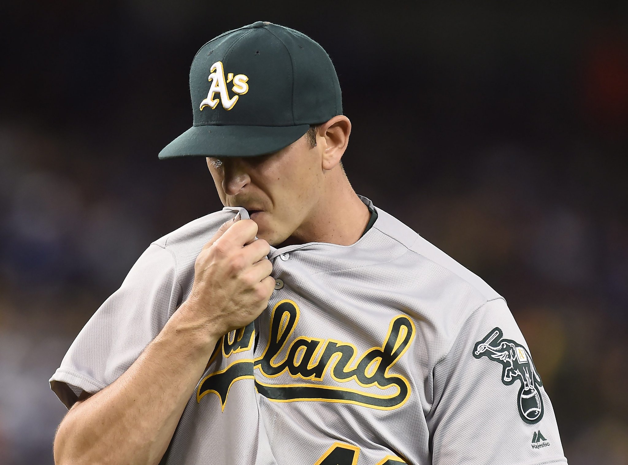 A’s demote Eric Surkamp, call up reliever Andrew Triggs