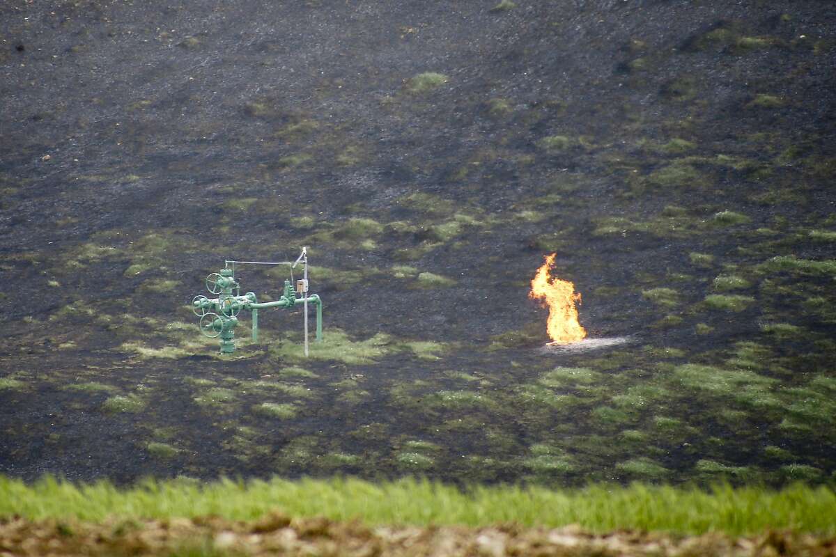 Soaring fireball in gas explosion torches homes