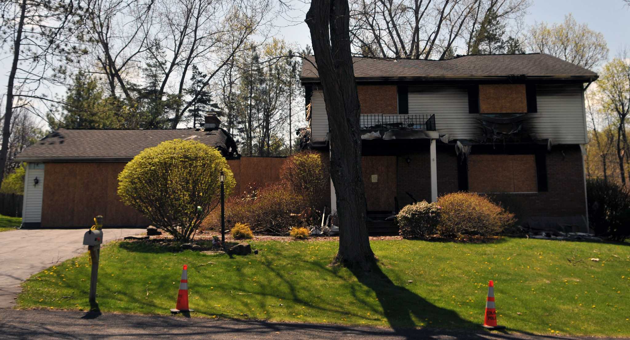 Colonie neighbors want burned murder-suicide house razed