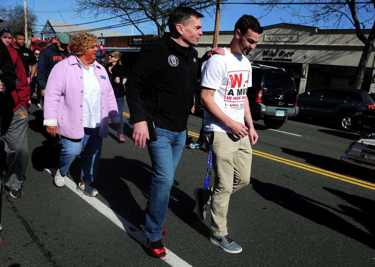 Men in heels join Fairfield crowd to ‘Walk a Mile in Her Shoes’