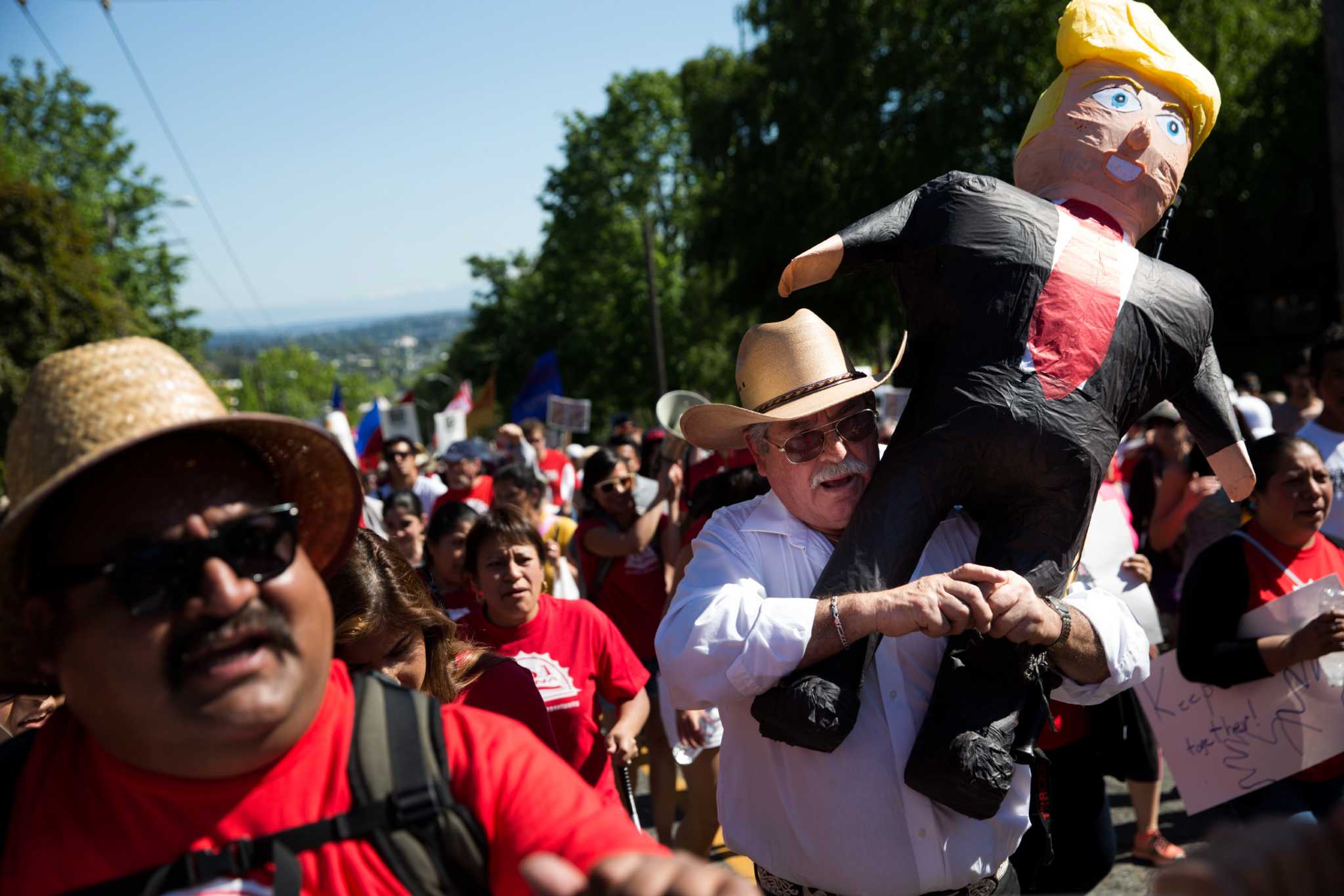 Thousands attend annual immigration and workers' rights march on May Day