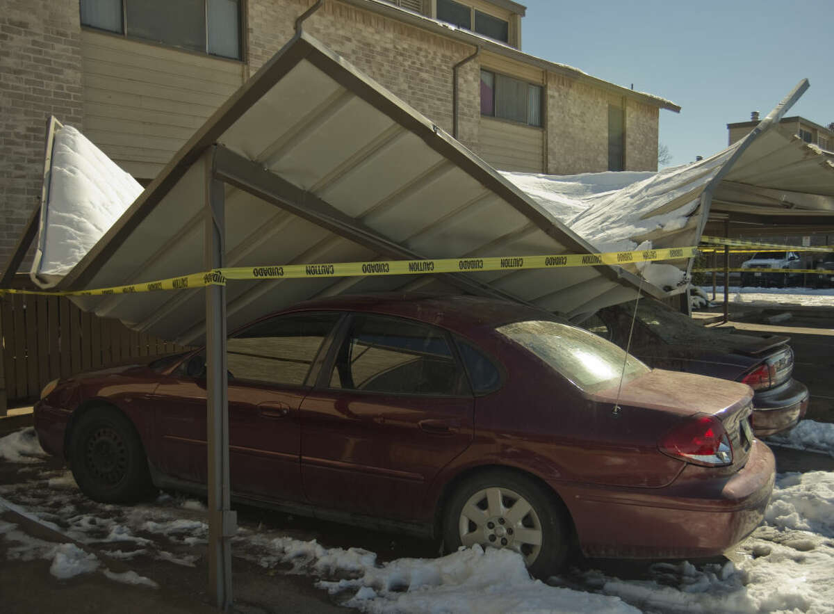 Snow causes carports to cave in on parked cars