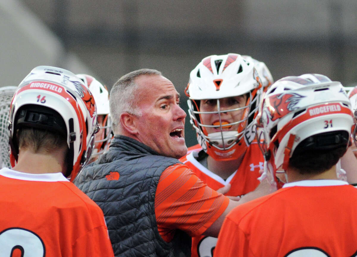 Ridgefield boys lax overpowers New Canaan