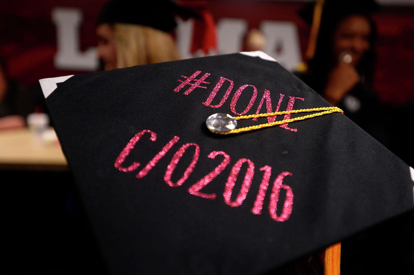 Lamar graduates customize caps