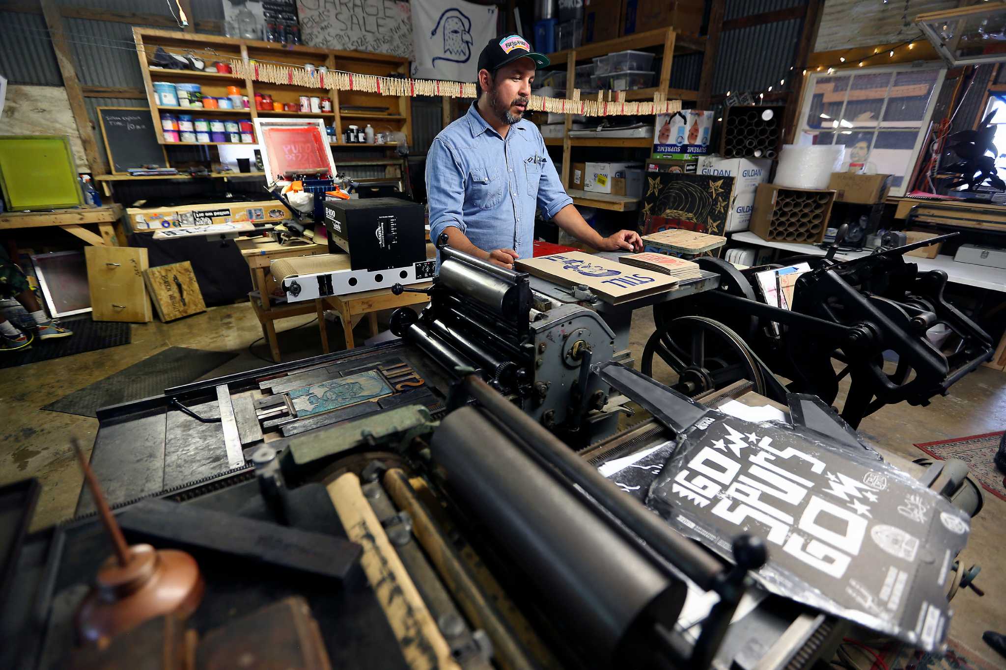 Artist blends politics with print shop