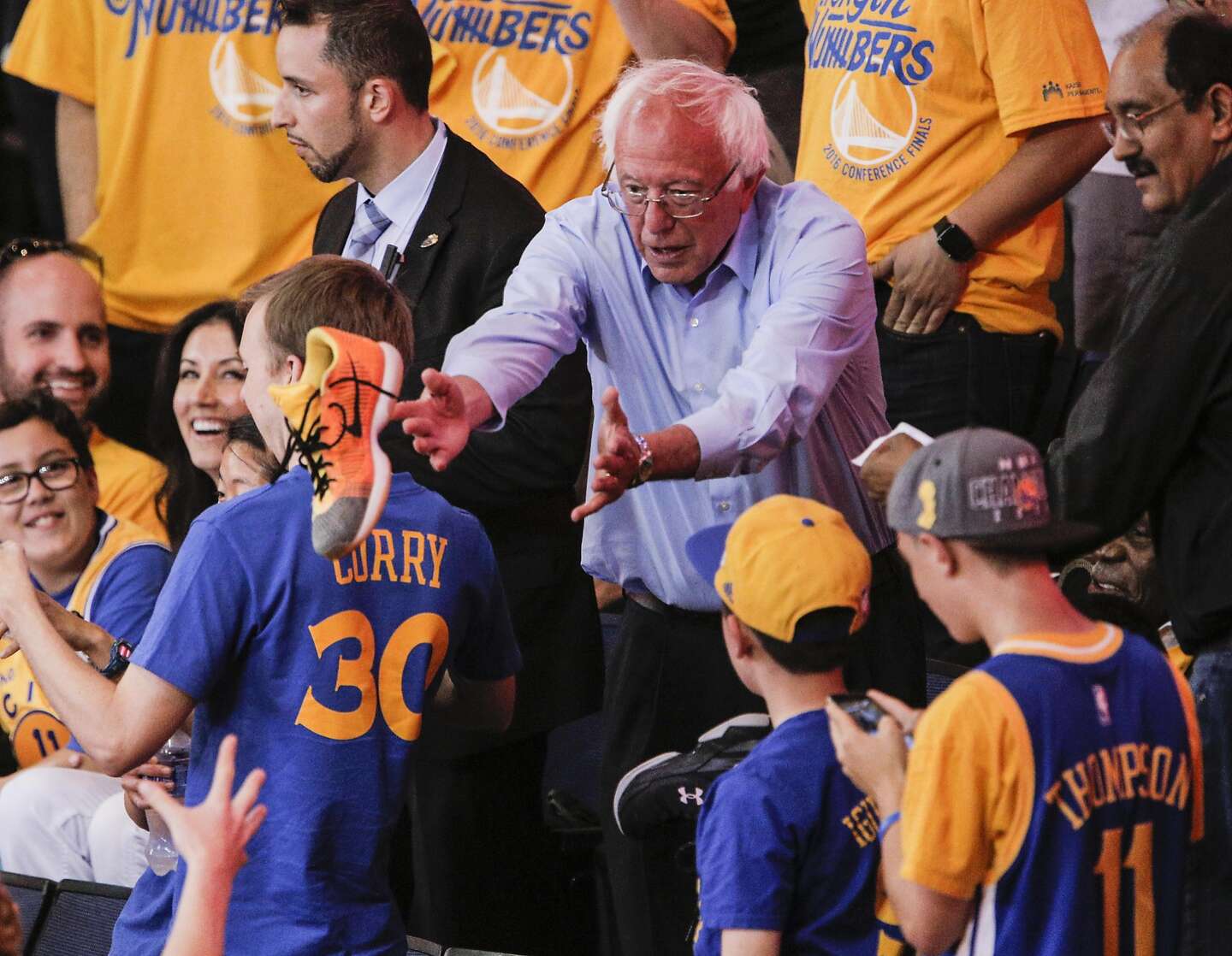 Presidential candidate Bernie Sanders arrives at halftime