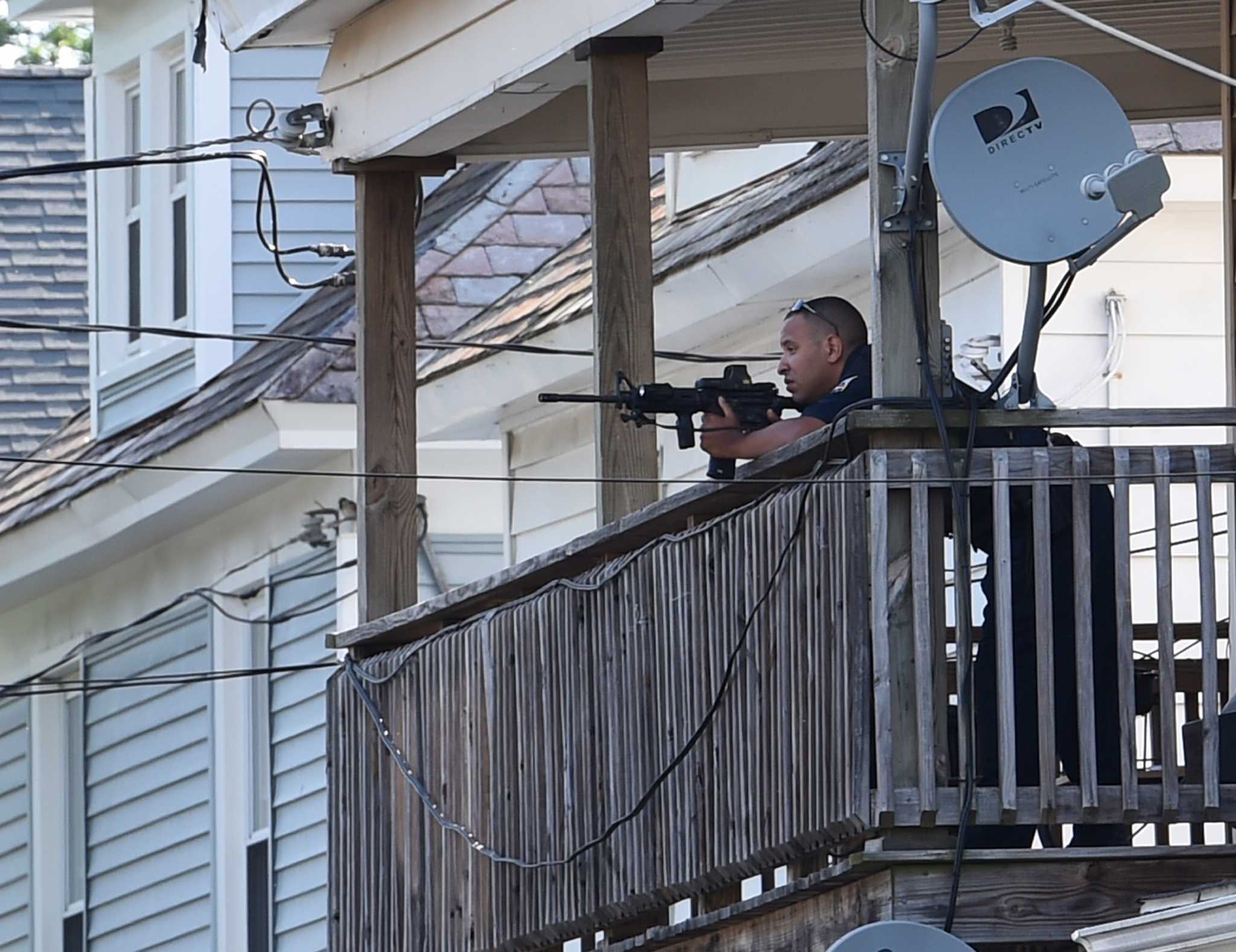 Cops: Parolee in standoff shot victim in gut