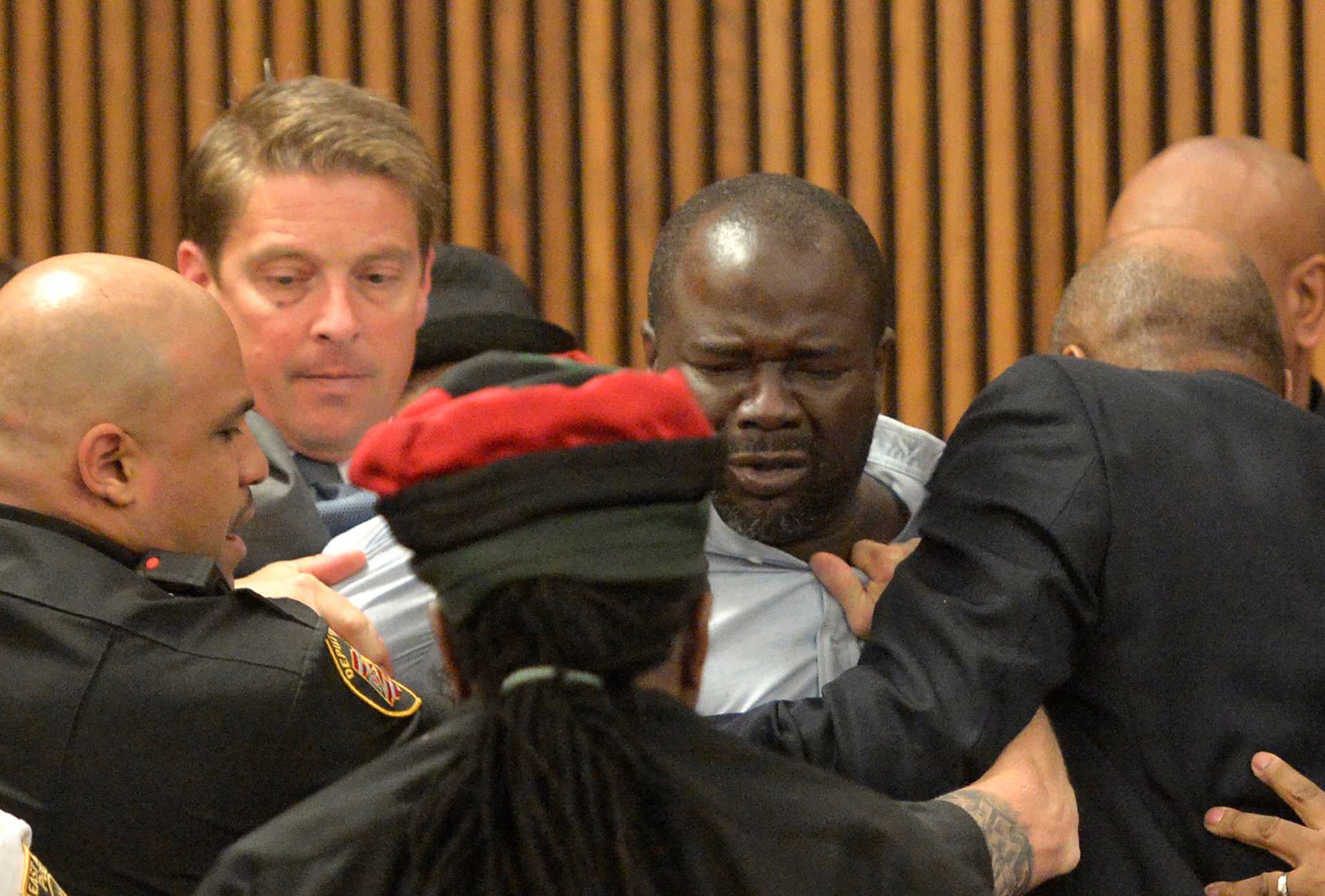 Victim’s dad jumps over table to attack her killer in court Victim’s dad jumps over table to attack her killer in court
