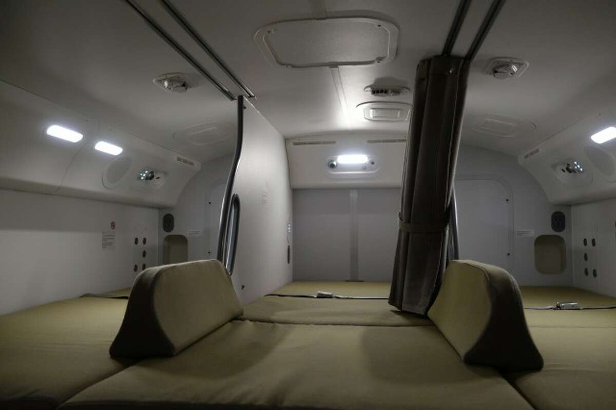Inside the secret hideaways where flight attendants sleep on Boeing's 747