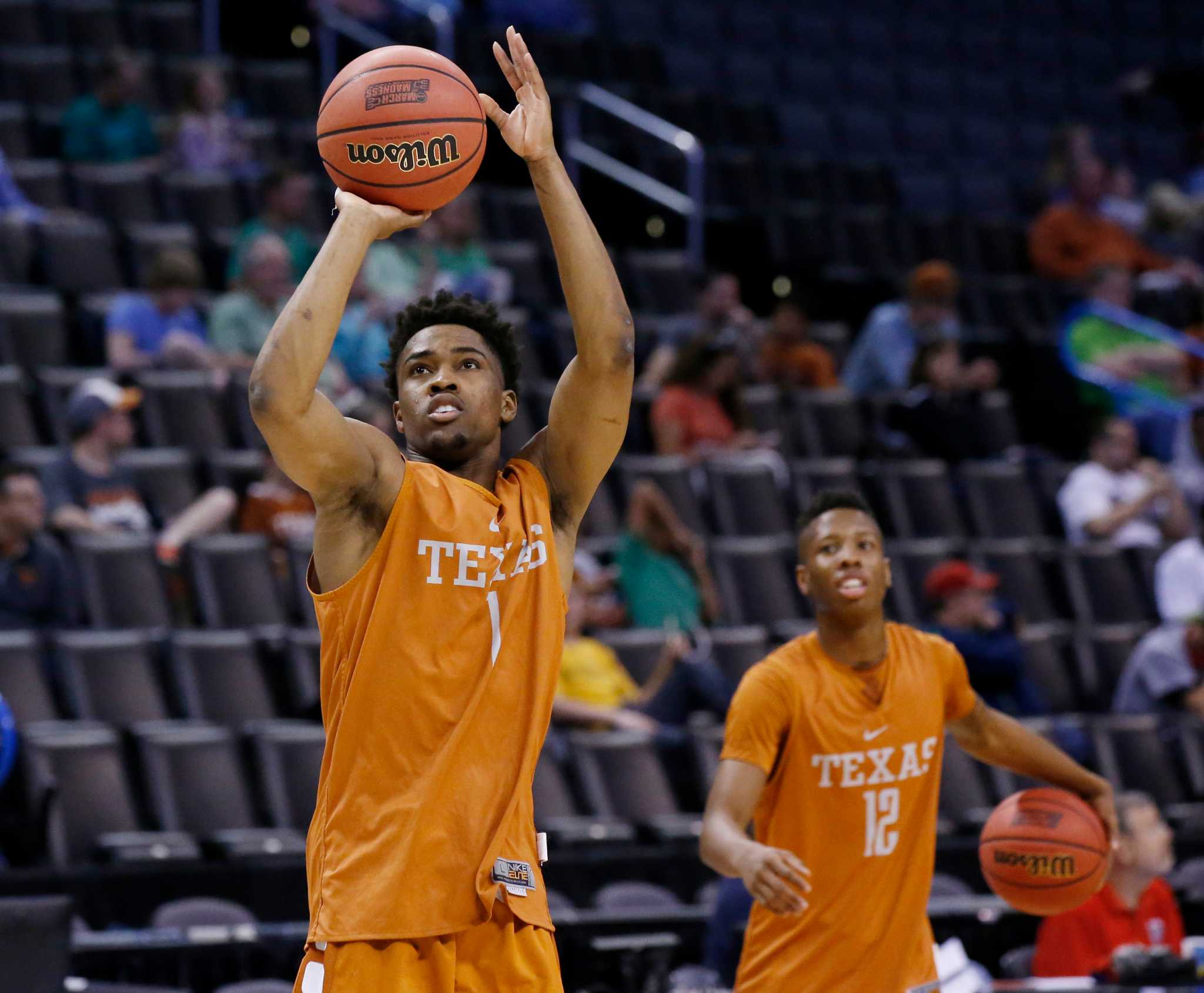 Texas suspends Kerwin Roach, Tevin Mack for exhibition game