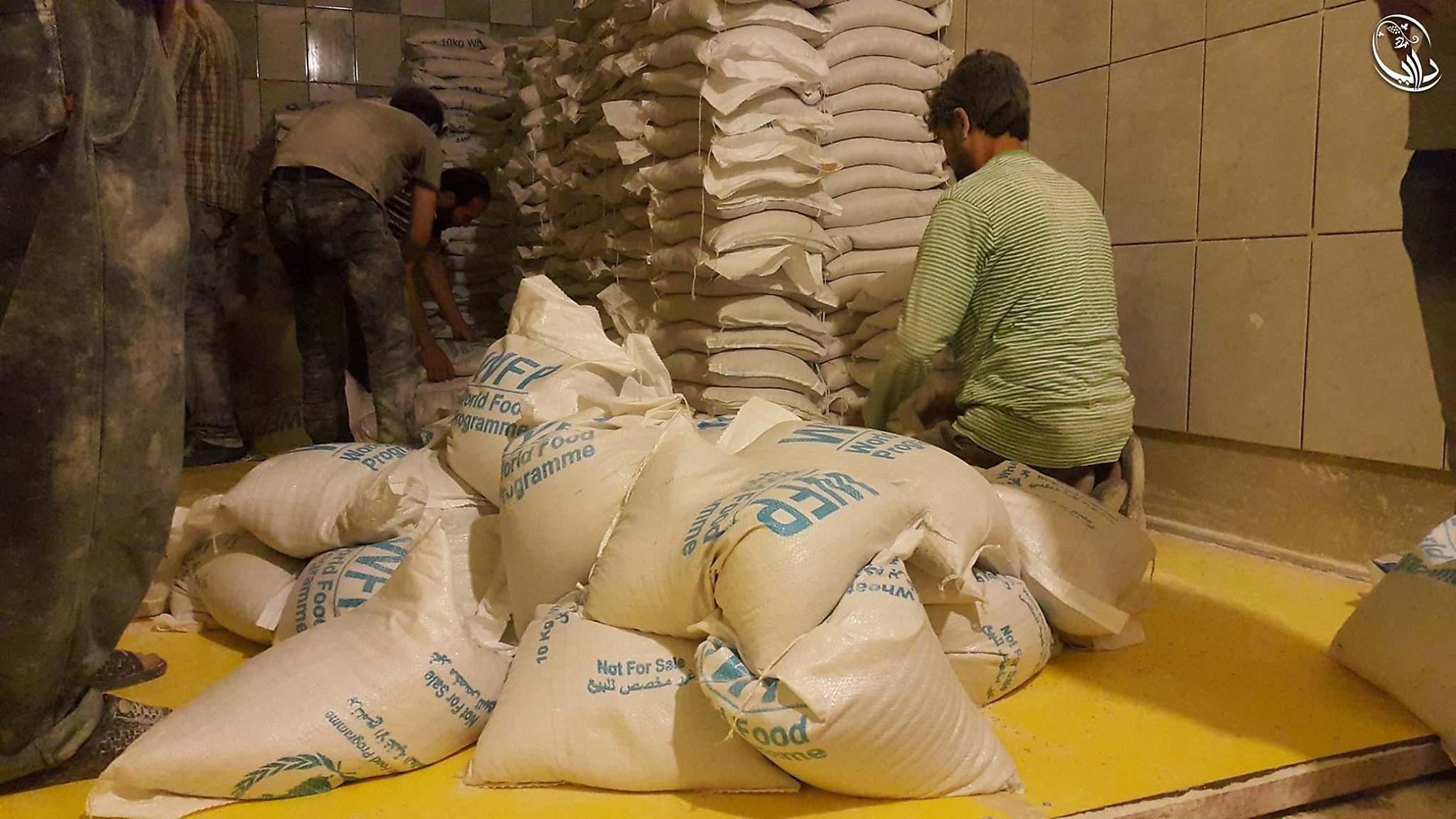 After years of siege, food aid reaches rebel-held suburb in Syria