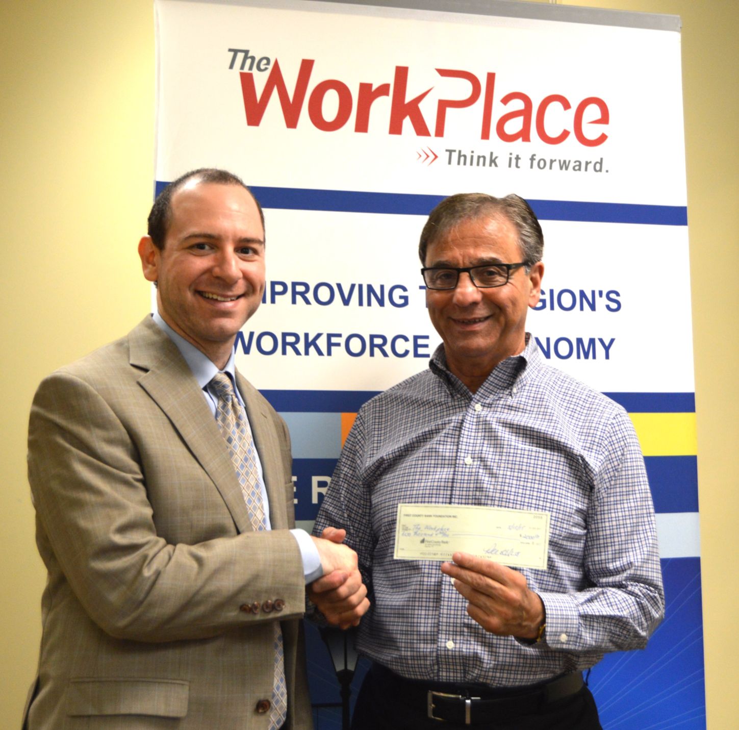 The WorkPlace receives $2,000 check from First County Bank