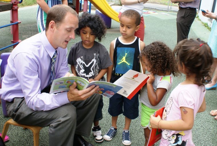 First County employees donate books to local education group