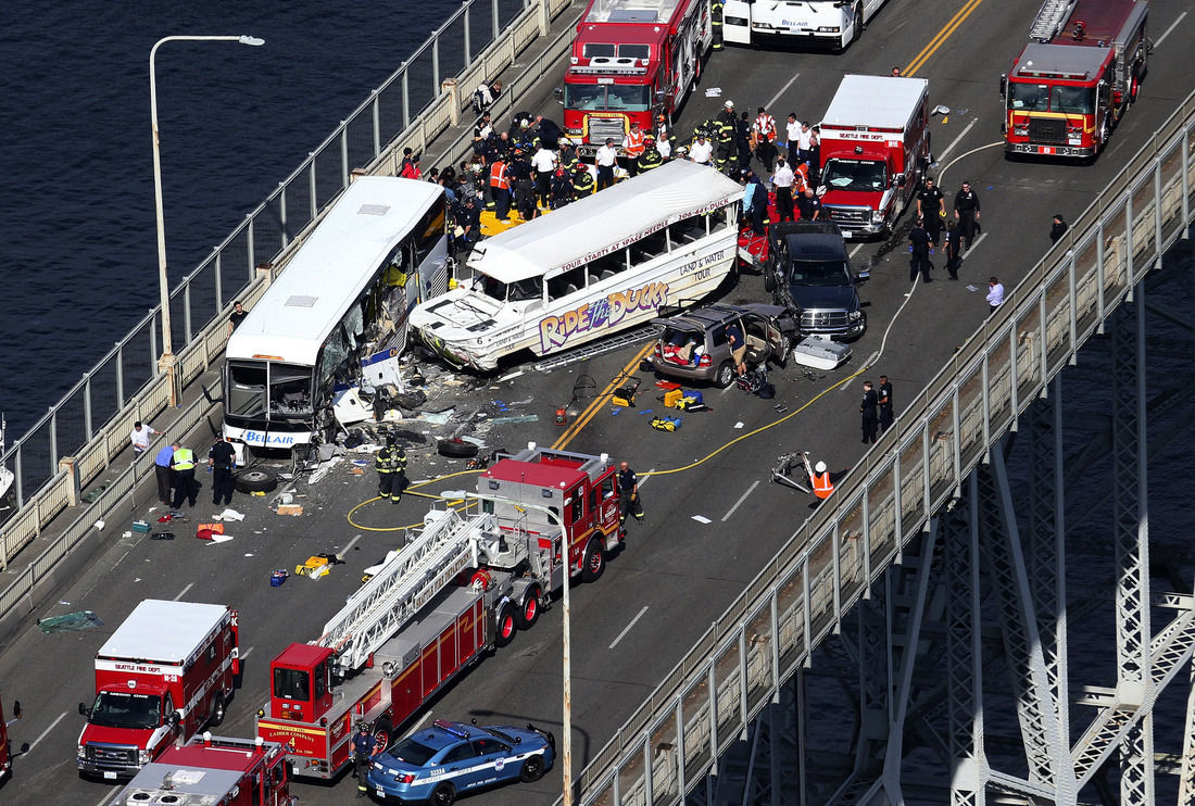Tour vehicle, charter bus collide on Seattle bridge; 4 dead