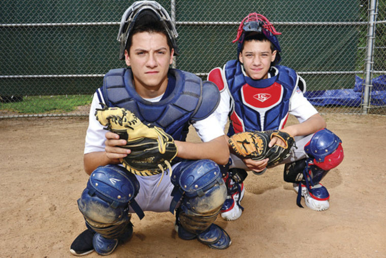 It runs in the family: Dumas brothers anchor summer squads behind the plate