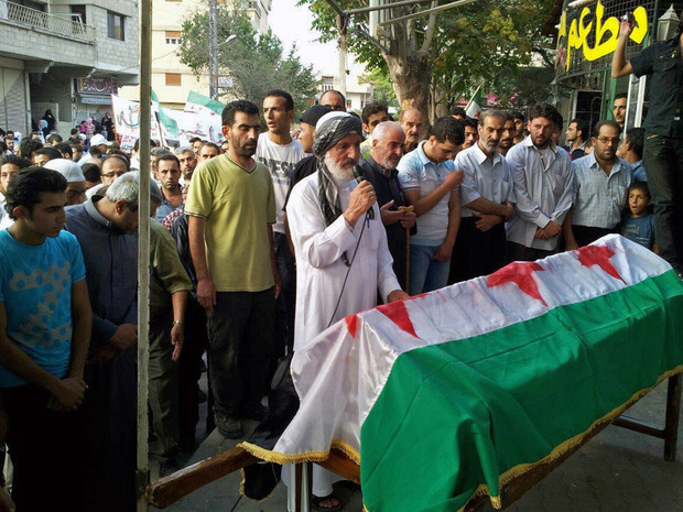 Syrian troops shell neighborhoods in Damascus