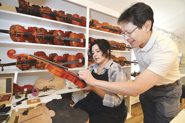 Purchase of thousands of string instruments bolsters Norwalk music company