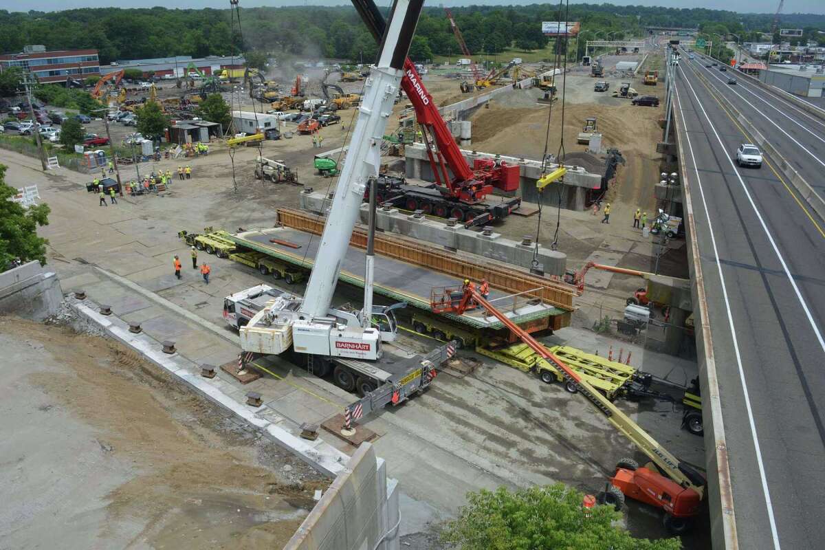 Photos: Workers put last pieces on new Route 8/25 bridge