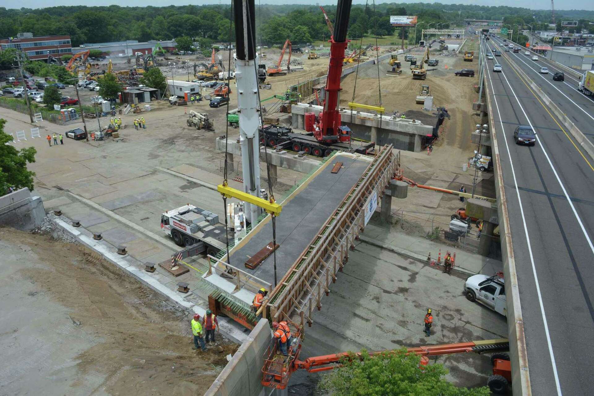 Photos: Workers put last pieces on new Route 8/25 bridge